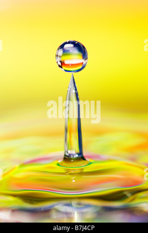 Rainbow coloured water drop and ripple Stock Photo - Alamy
