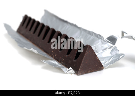Triangular shaped dark chocolate bar in silver foil Stock Photo - Alamy