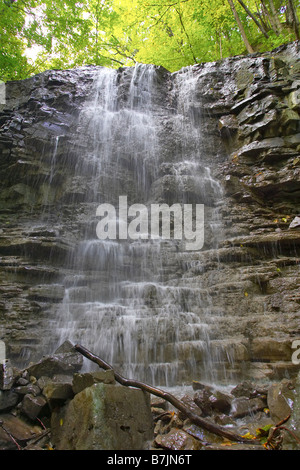 A vertical shot of waterfalls over rocks with long exposure in the ...