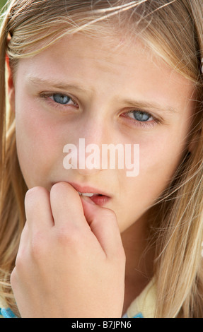 Girl biting nails Stock Photo - Alamy