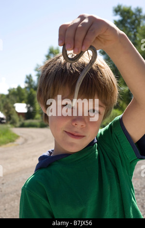 Boy Holding Snake Stock Photo - Alamy