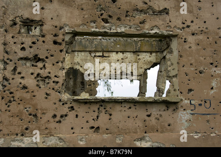 Abandoned house riddled with bullet holes during the Siege of Vukovar ...