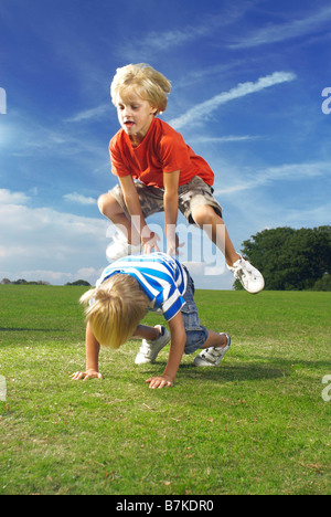 active children playing leapfrog and jumping Stock Photo - Alamy