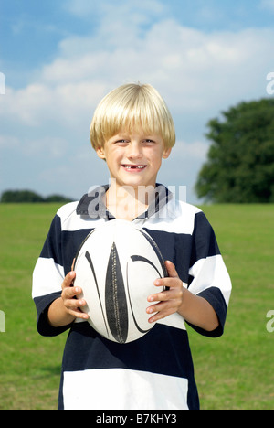 Young boy lad rugby player with rugby ball and gum guard Stock Photo ...