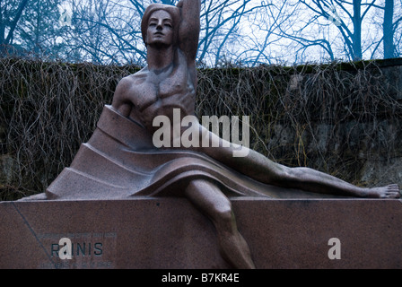 Tomb, statue of Latvian poet Rainis, Meza Kapi forest cemetery, Riga ...