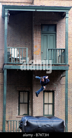 stunt man falling from an upstairs balcony on a movie film set ...