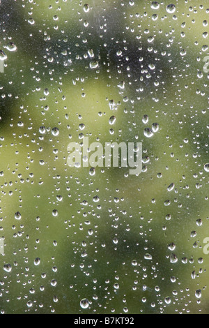 rain droplets on a window creating abstract pattern Stock Photo - Alamy