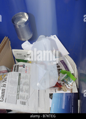 waste paper falling into recycle bin Stock Photo - Alamy