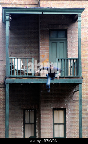 stunt man falling from an upstairs balcony on a movie film set ...