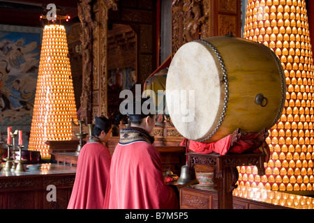 Tao monks performing a religious ceremony with musical instruments at ...