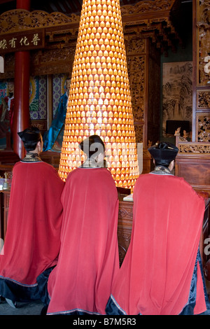 Tao monks performing a religious ceremony with musical instruments at ...