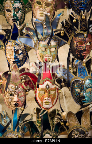 Masquerade masks for the ball, hanging in a row on a wall Stock Photo ...