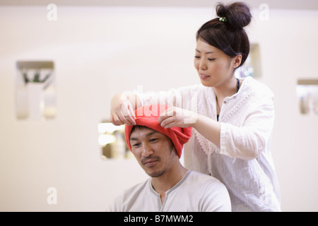 Hairdresser setting hair Stock Photo - Alamy
