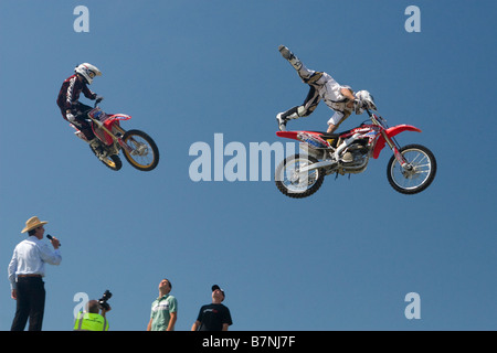 Motorbikes jumping over a ramp sky pictures Stock Photo: 21986653 - Alamy