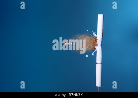 A bullet hitting cigarettes Stock Photo - Alamy