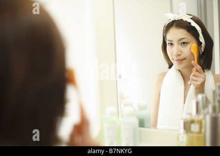 Woman caring for her face Stock Photo - Alamy