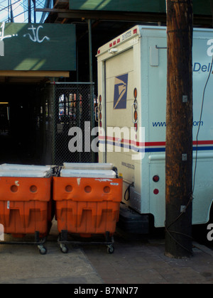 Full orange mail bins lined up and waiting to be loaded onto a USPS ...