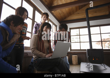 Young people having fun with laptop Stock Photo - Alamy