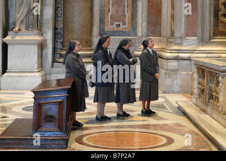 Nuns in St Peters Basilica Rome listening to a reading by a priest ...