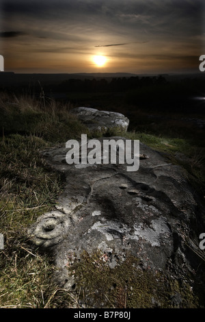 Prehistoric cup and ring marks rock art carved on rock at Brigantium ...