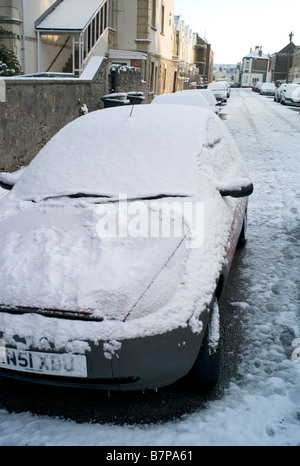 City street and cars covered in snow after snowfall in Montreal, Canada ...