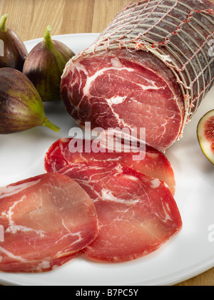 Italian sliced cured coppa ham with spices. Isolated, white background ...