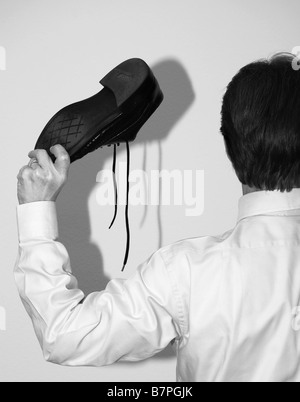 Image portraying the action of throwing a shoe, Arab insult Stock Photo ...