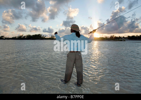 Bonefishing guide Shawn Leadon fishing for bonefish in shallow waters ...