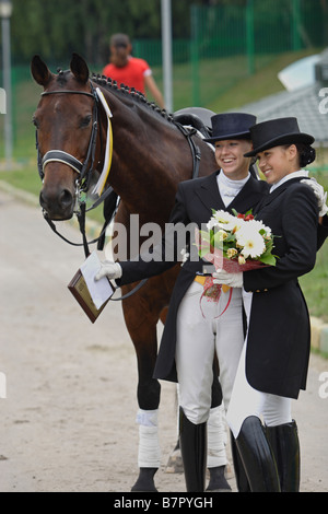 Dressage. Two equestrian girls Stock Photo - Alamy