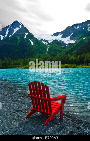 Red Adirondak chair along lakeshore, Alaska Stock Photo - Alamy