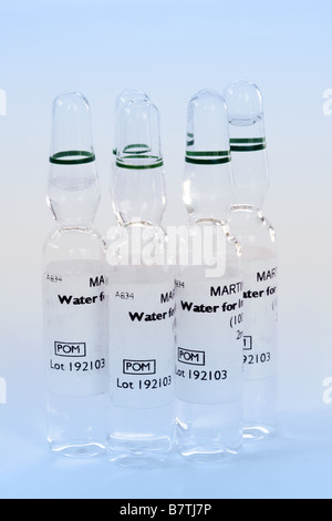 Glass medical ampoule vial for injection. Medicine is dry white drug ...