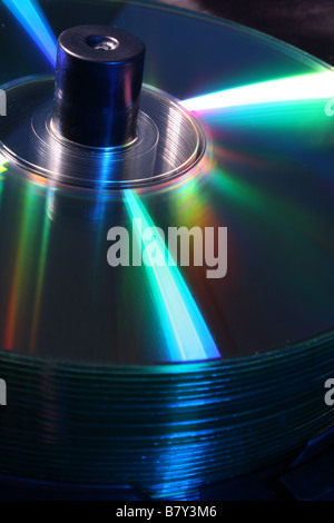 stack of CD's on a spindle lit with red and blue studio lighting Stock ...
