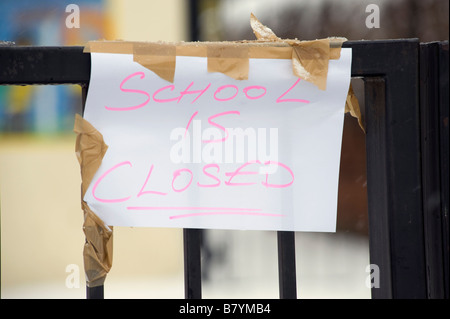 A notice board outside a school announcing closure due to bad weather ...