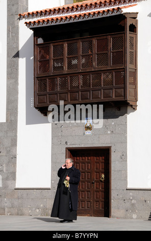 catholic priest with mobile phone Stock Photo - Alamy