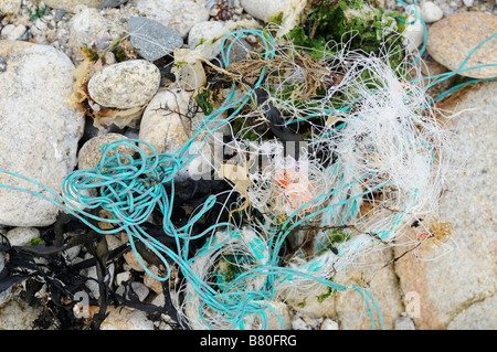 Garbage and debris fishing line and litter scattered along the bottom ...