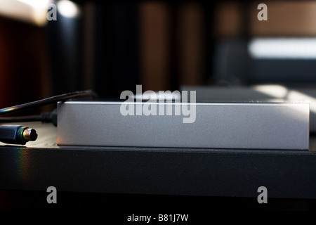 Side view of silver external hard disk with cables on rack shelf Stock ...