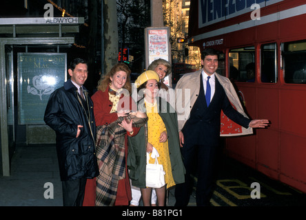 A group of the British Royal family impersonators queueing at a bus ...