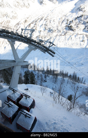 Snow-capped cable cars which take passengers from Montenvers rack ...
