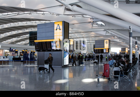 Passengers waiting at the British Airways check in desks at Heathrow ...