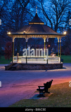 Bandstand in Hexham Park at night with floodlit Abbey. Northumberland ...