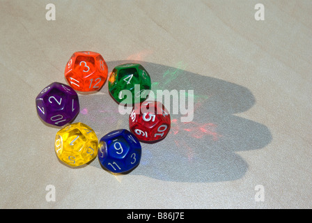 Multi colored twelve sided dice Stock Photo - Alamy