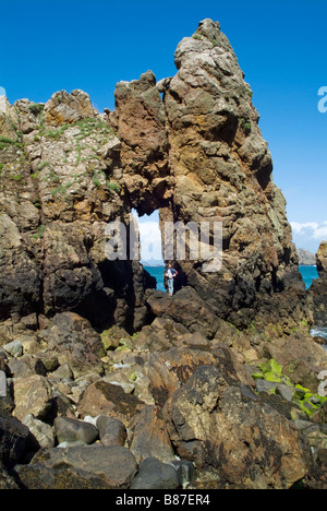 Stone archway off the coast of Sark Stock Photo - Alamy