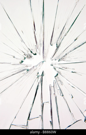 Impact point on a pane of glass Stock Photo - Alamy