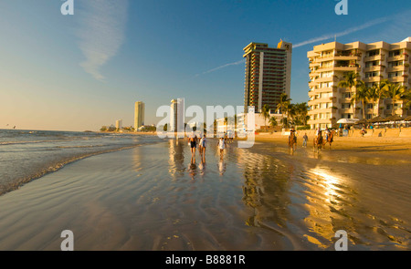 MEXICO SINOLA STATE MAZATLAN People enjoying beach activities with ...