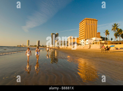 MEXICO SINOLA STATE MAZATLAN People enjoying beach activities with ...