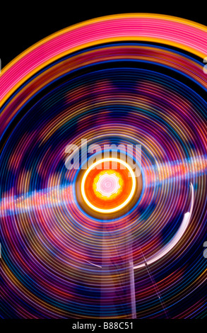 Abstract photograph of the light trails on a fun fair attraction Stock ...