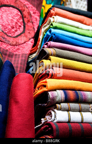 Colorful folded fabric and textile materials displayed in home ...