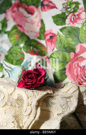 Antique lace, vintage cabbage rose fabric draped with various shades of ...