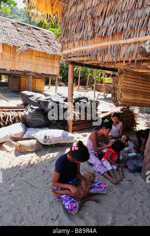 Moken sea gypsy family in a small island village off the coast of south ...