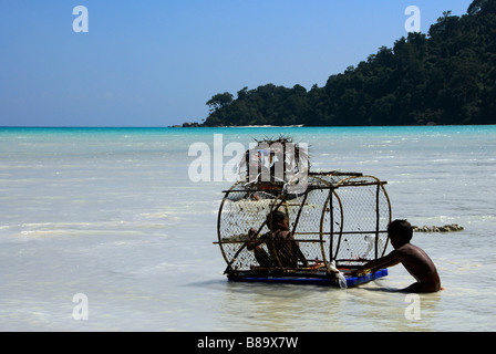 Moken sea gypsy boys enjoy playing with the fish net,Surin Island ...